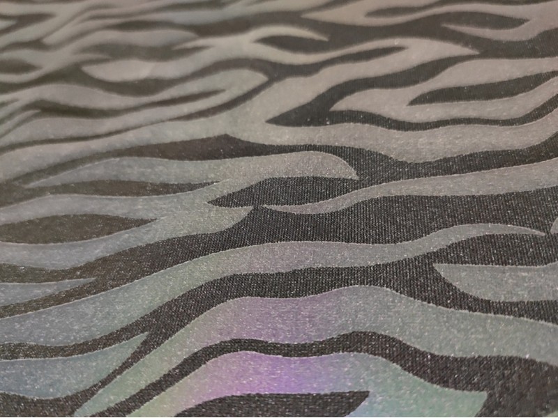 Reflective rainbow fabric with print